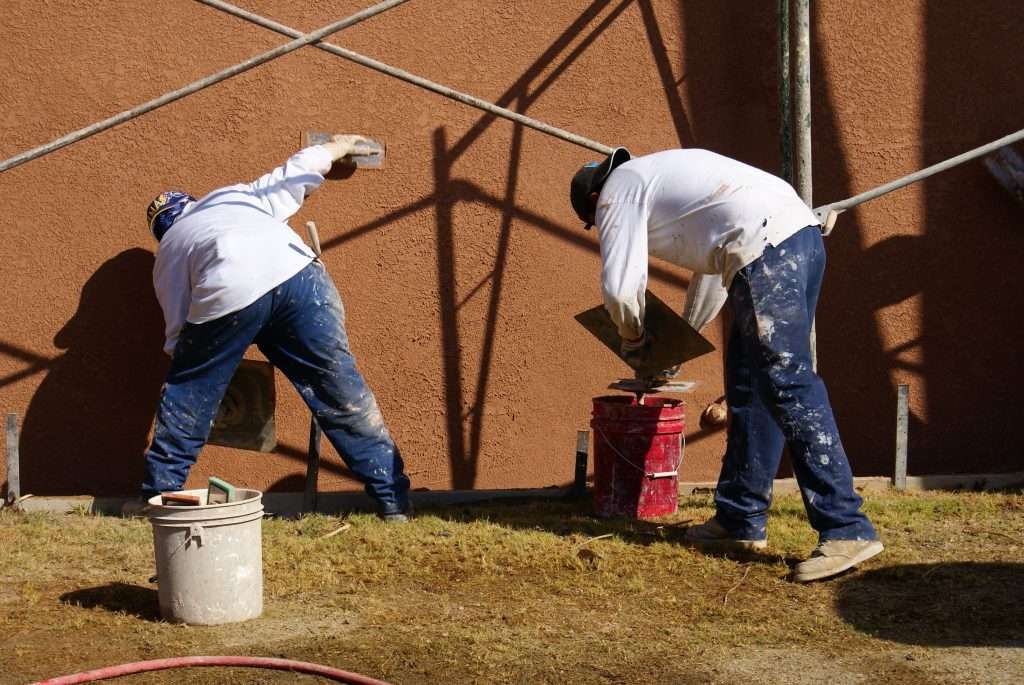 Why Low-Skilled Immigrants Work Especially Hard